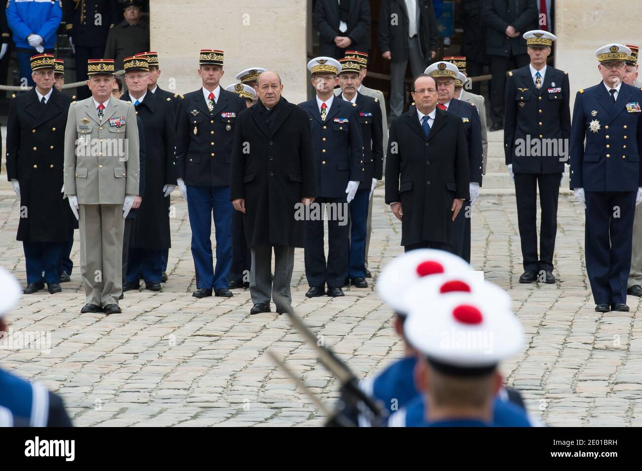 French President Francois Hollande flanked by Defence Minister Jean ...