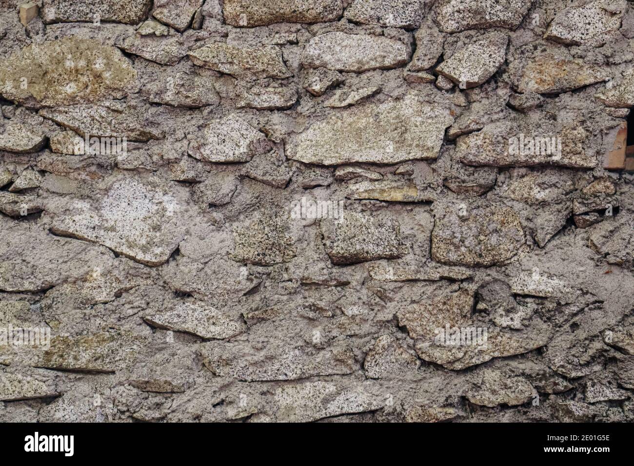 old wall texture made of stones, bricks and concrete. Old house and ...