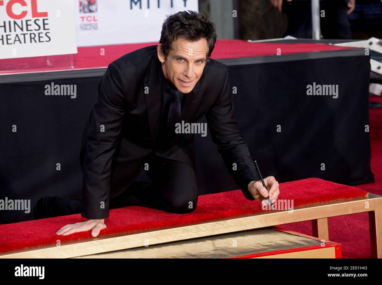 Ben Stiller poses as he is honored with a hand and footprint ceremony ...
