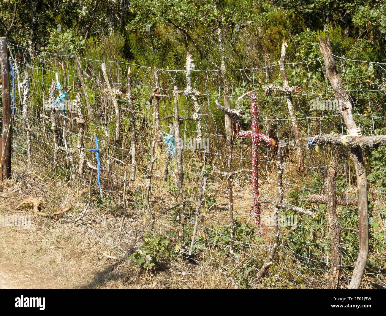 Fence decorated with wooden crosses by pilgrims over the years ...