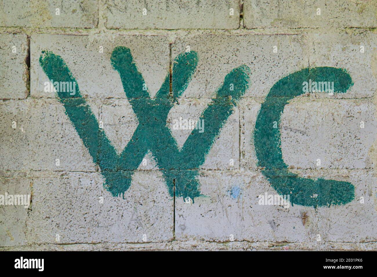 old gray brick wall texture with WC writing above Stock Photo - Alamy