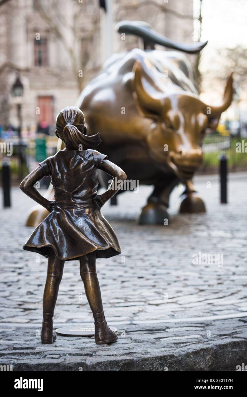 New York, USA. 13 March, 2017. Fearless Girl facing off with the Wall ...