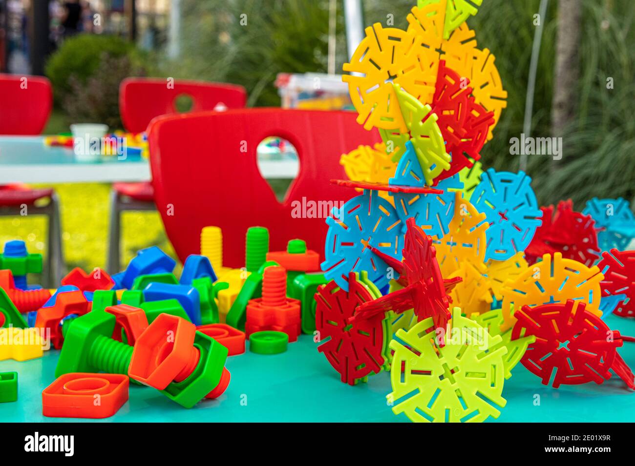 Close up of colorful plastic mosaic puzzle board game. colored plastic ...