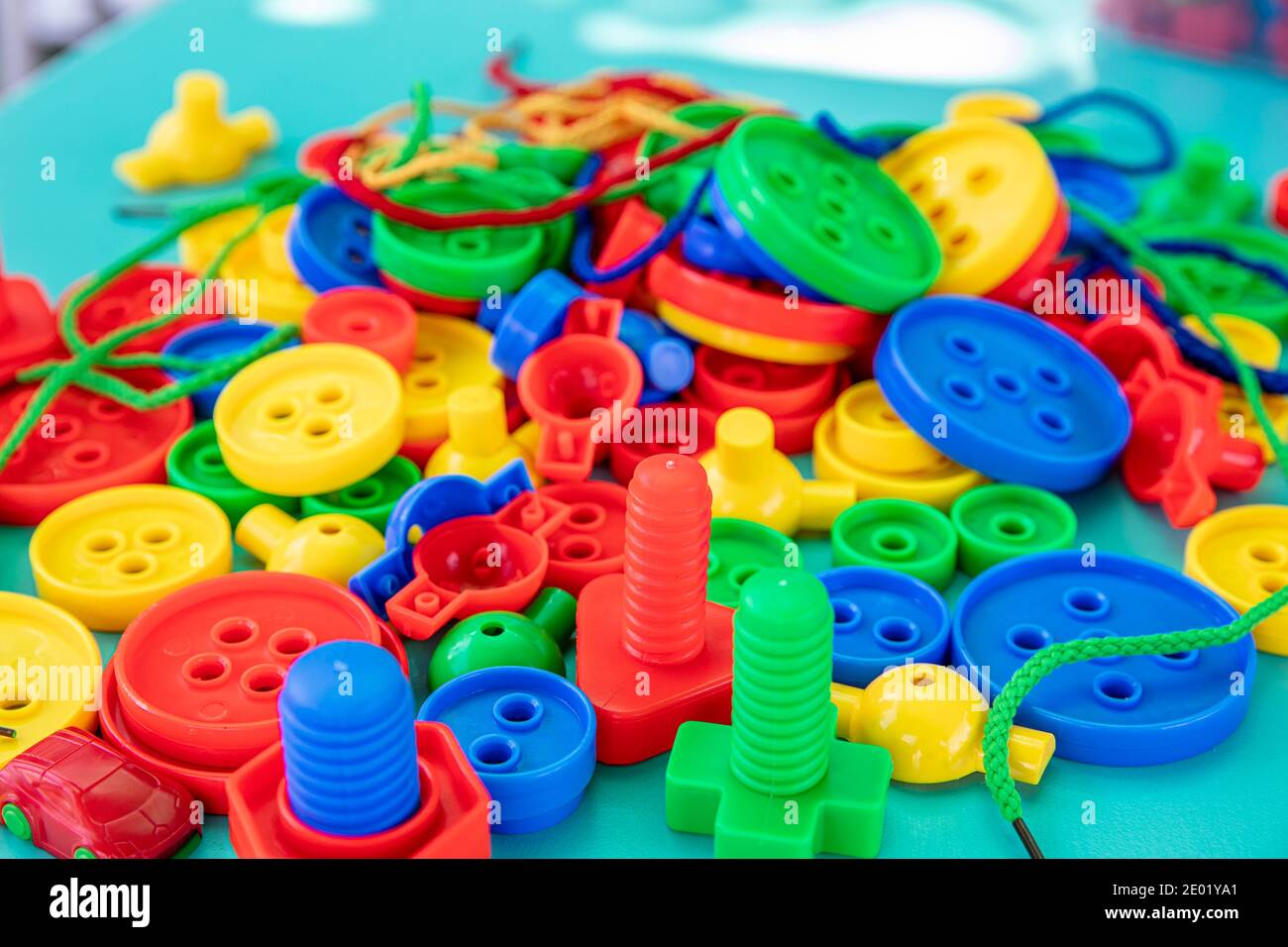 Close up of colorful plastic mosaic puzzle board game. colored plastic ...