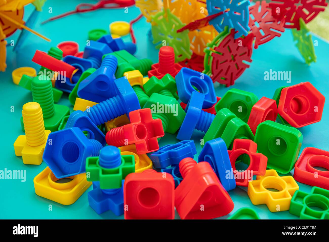 Close up of colorful plastic mosaic puzzle board game. colored plastic ...