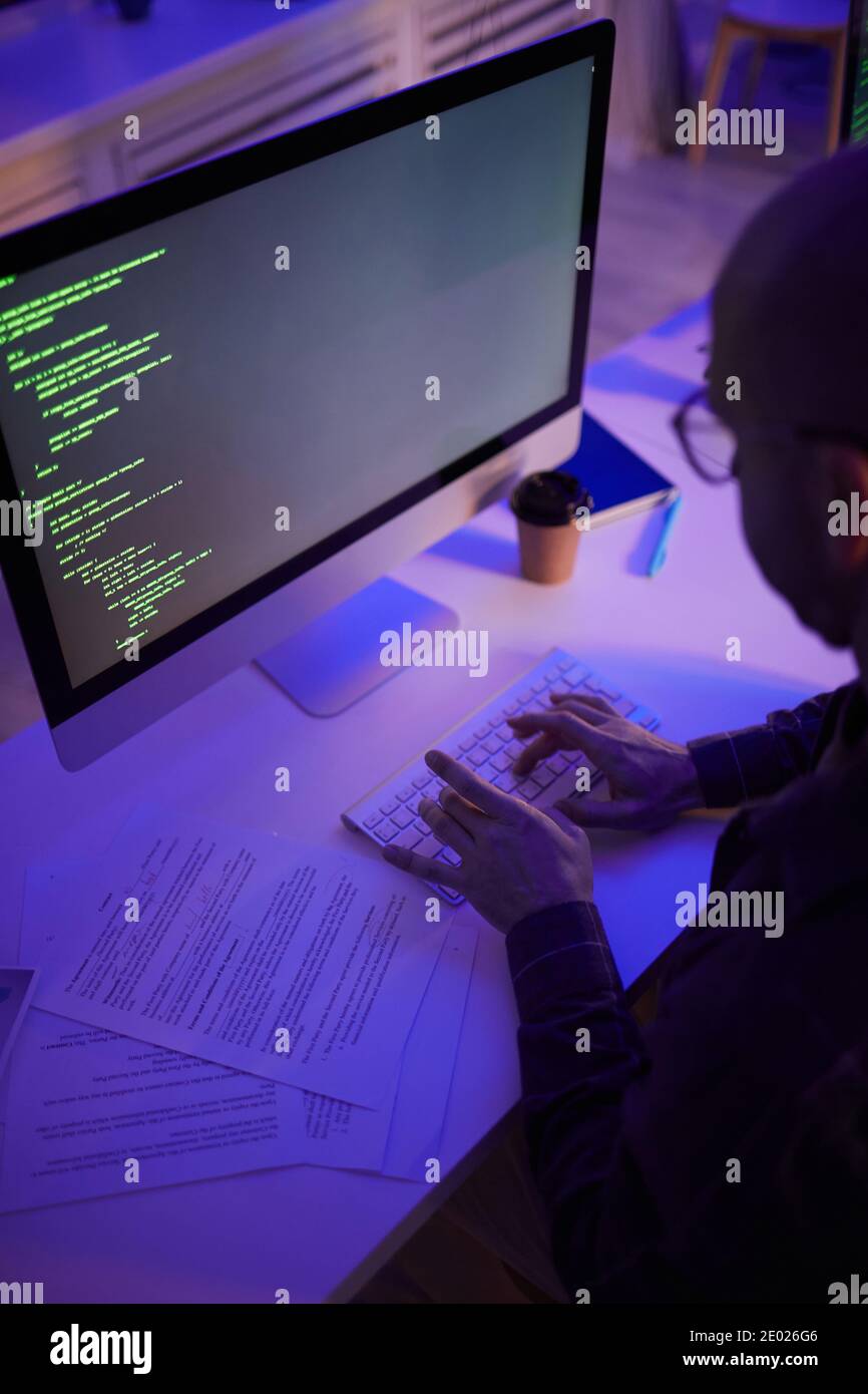 Vertical shot unrecognizable programmer sitting hi-res stock ...