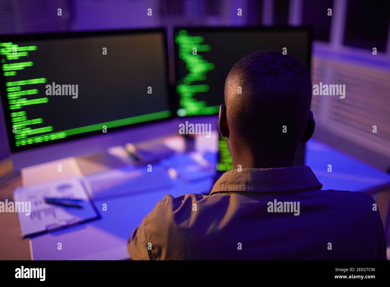Rear view shot of unrecognizable African American computer programmer ...