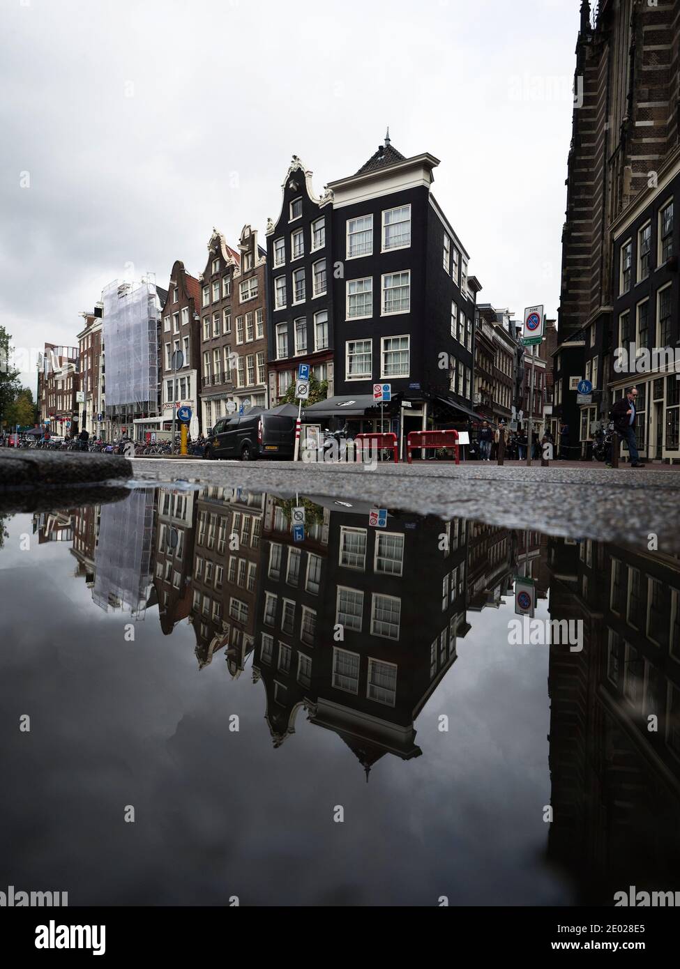 Typical Amsterdam architecture street houses reflection in rain water ...