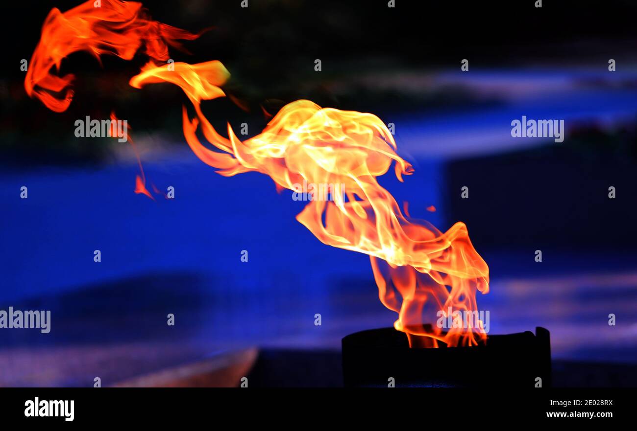 Photo of a bright fire on a dark background. Fire in the night Stock ...