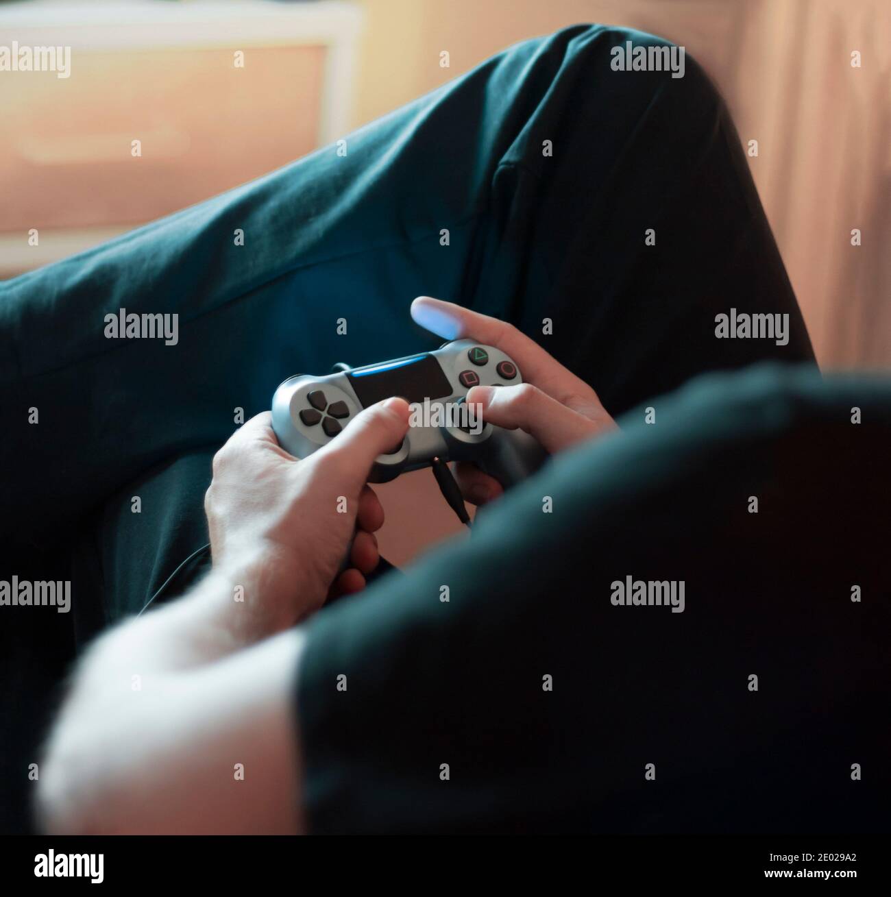 Man playing video games holding joystick in his hands. Funny leisure ...