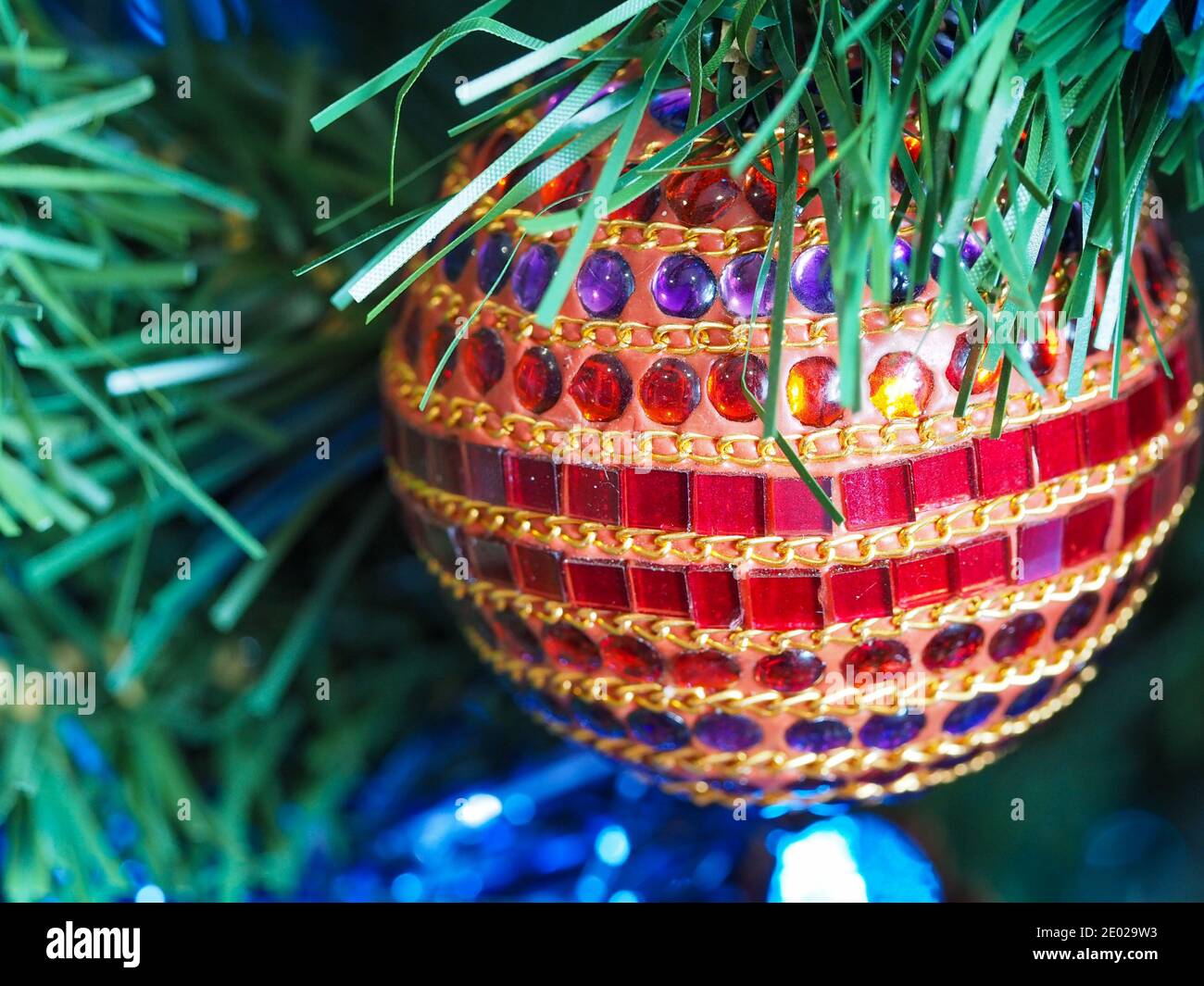 Christmas decorations, shiny multi-coloured bauble of red, gold and ...