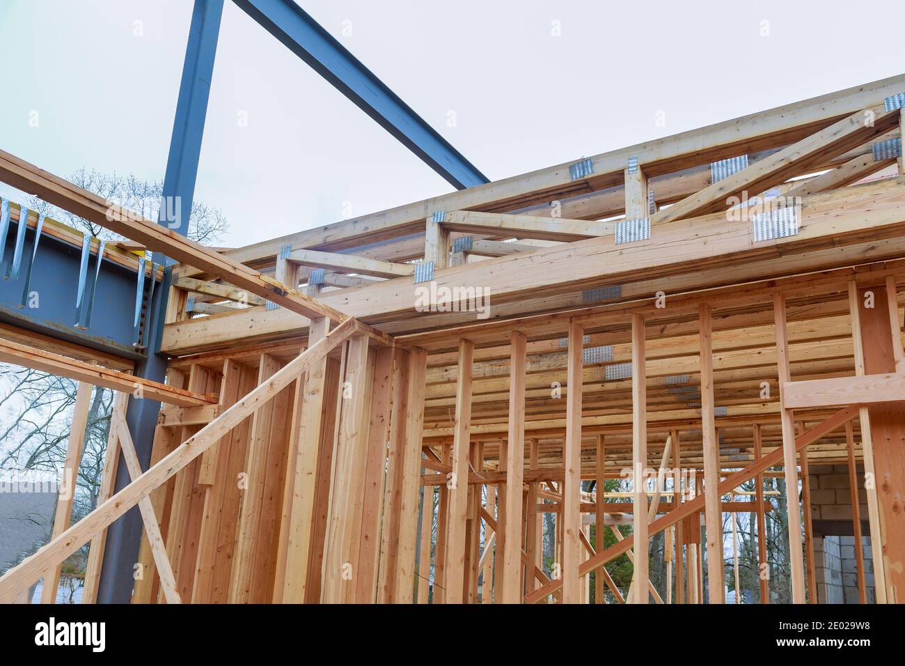 New home under construction on of framing of beams house Stock Photo ...