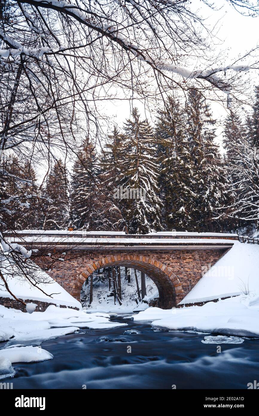 Old stone bridge in the winter hi-res stock photography and images - Alamy