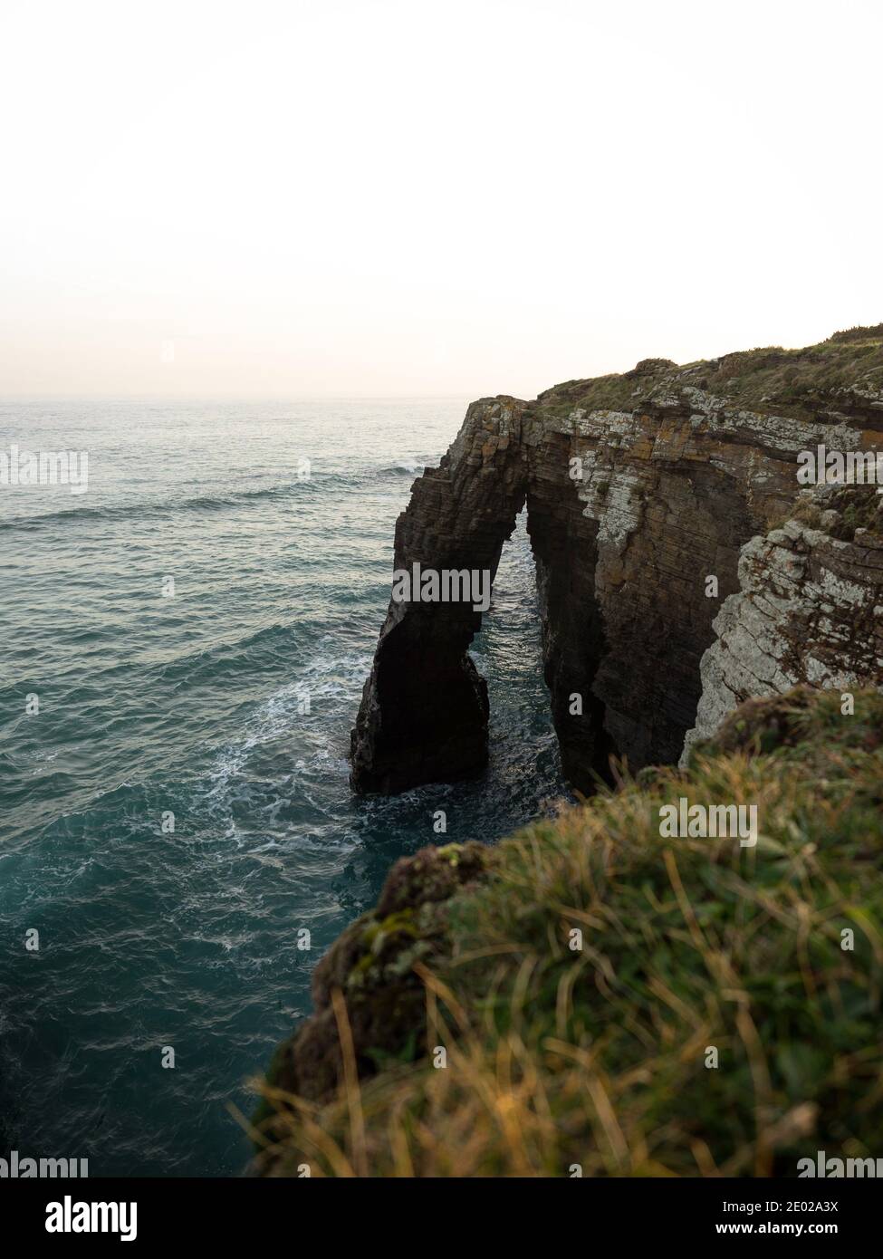 Massive natural arches at Praia as Catedrais Cathedrals Beach near ...