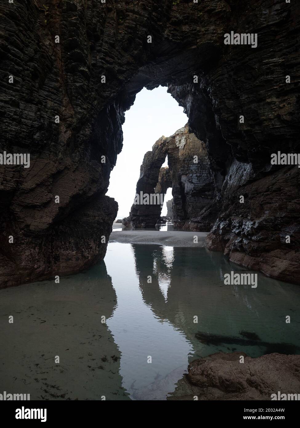 Massive natural arches visible at Praia as Catedrais Cathedrals Beach ...