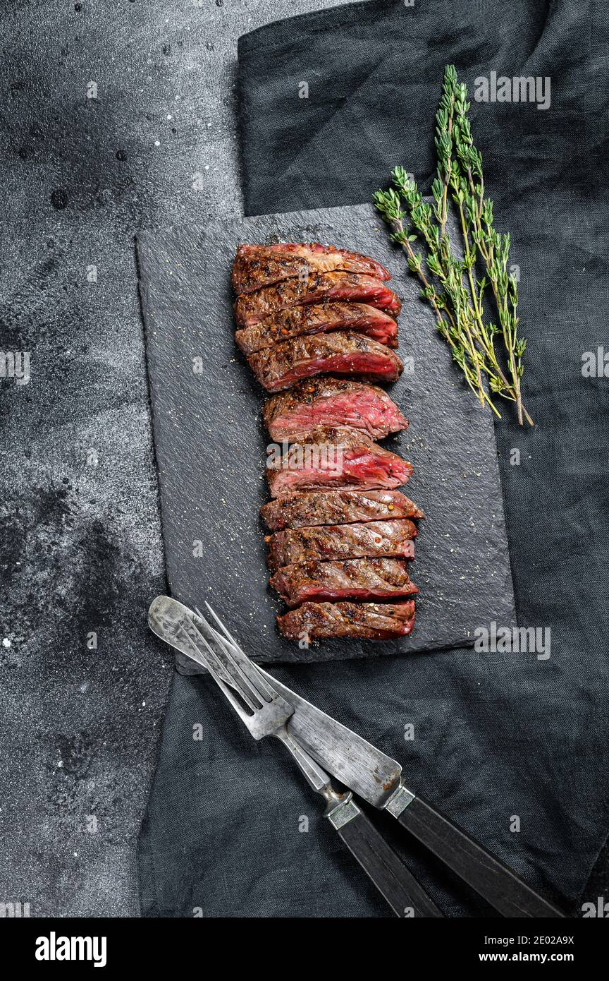 Grilled roasting rare sliced top blade, Denver steak. Marble meat beef ...