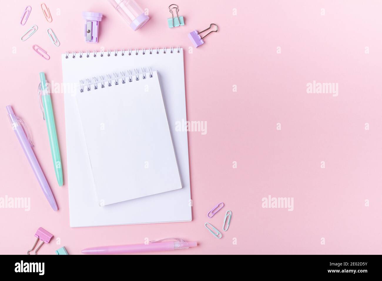 School background with notebooks and pastel colorful study accessories ...