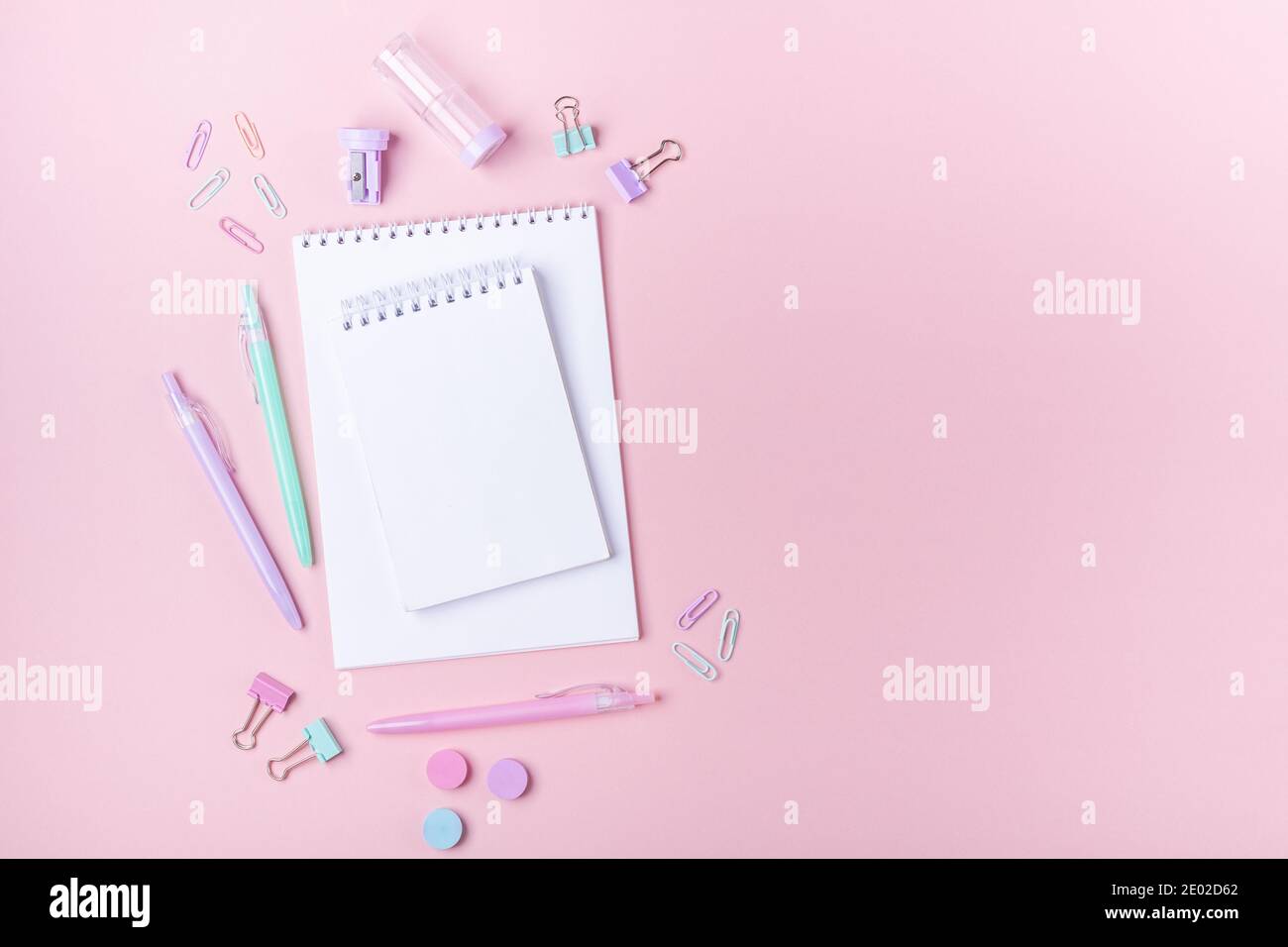 School background with notebooks and pastel colorful study accessories ...