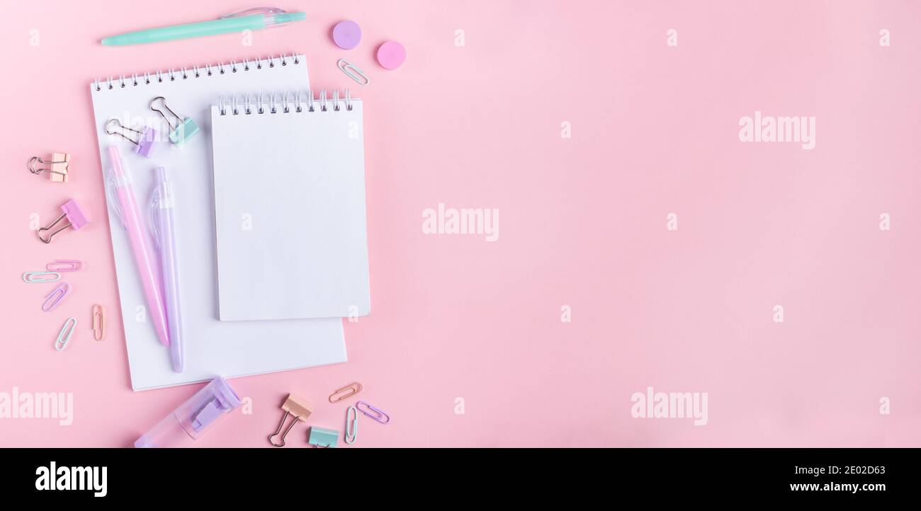 School background with notebooks and pastel colorful study accessories ...