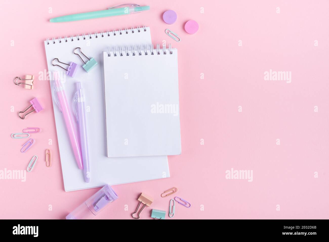 School background with notebooks and pastel colorful study accessories ...