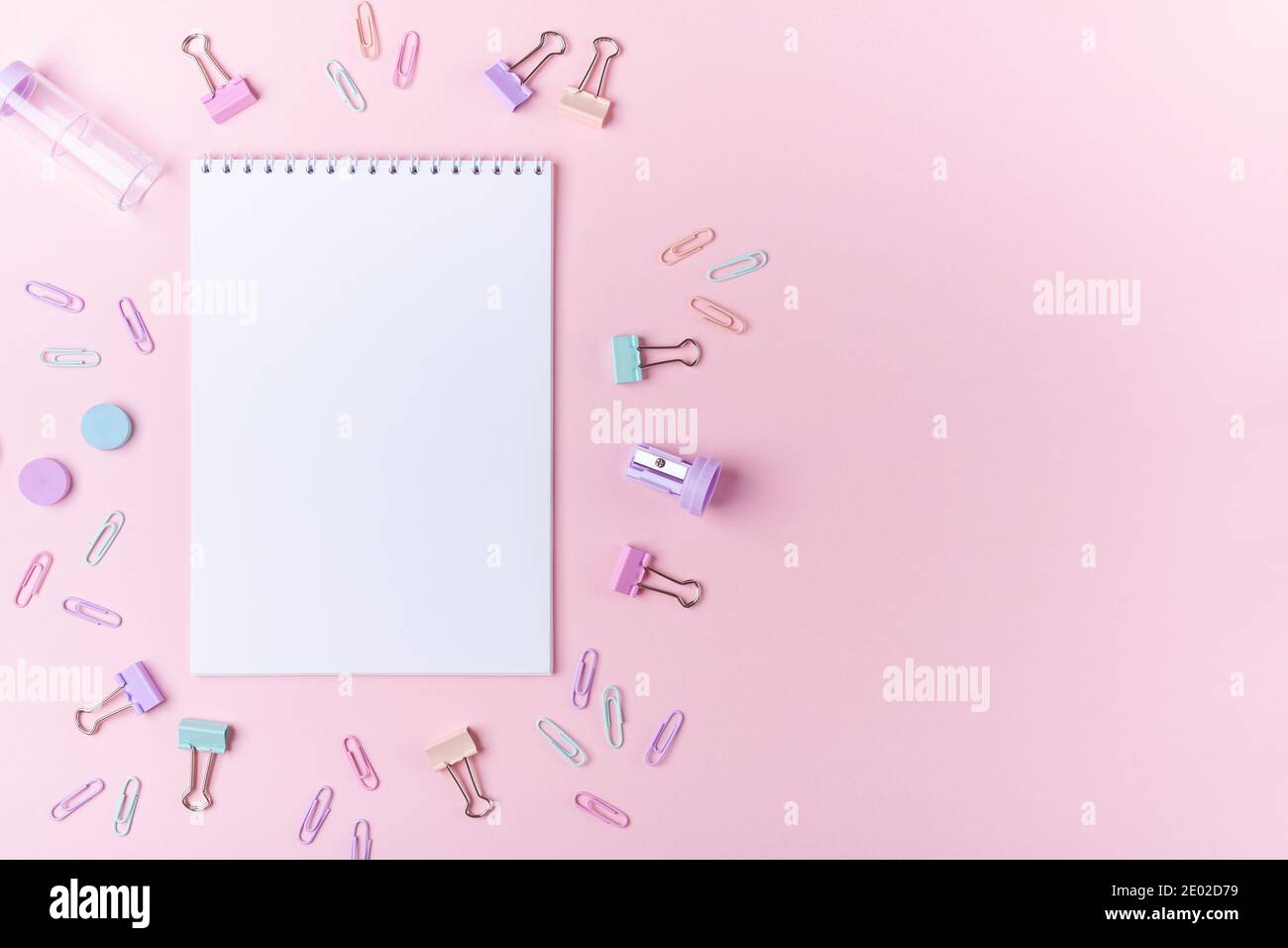School background with notebooks and pastel colorful study accessories ...