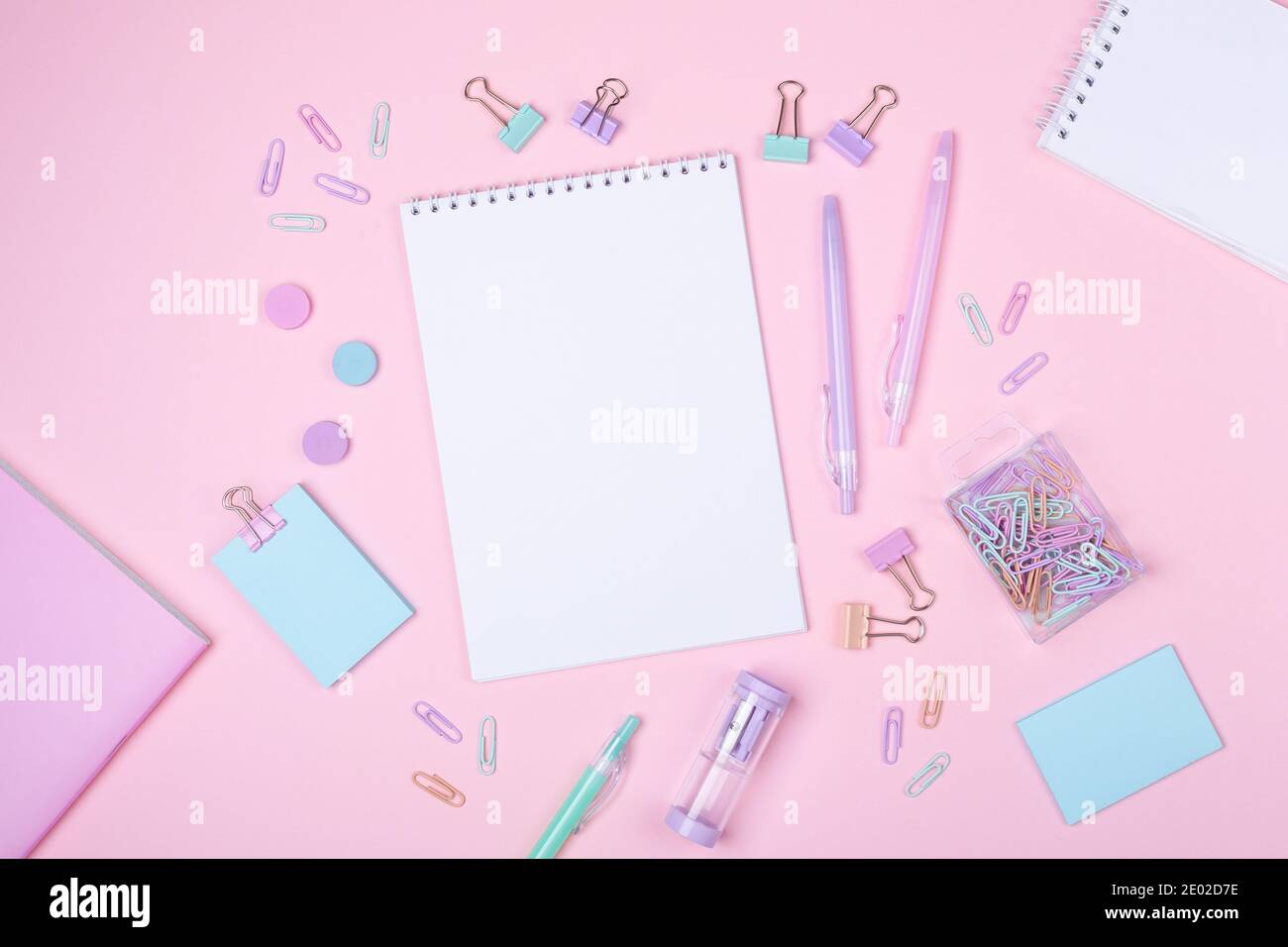 School background with notebooks and pastel colorful study accessories ...
