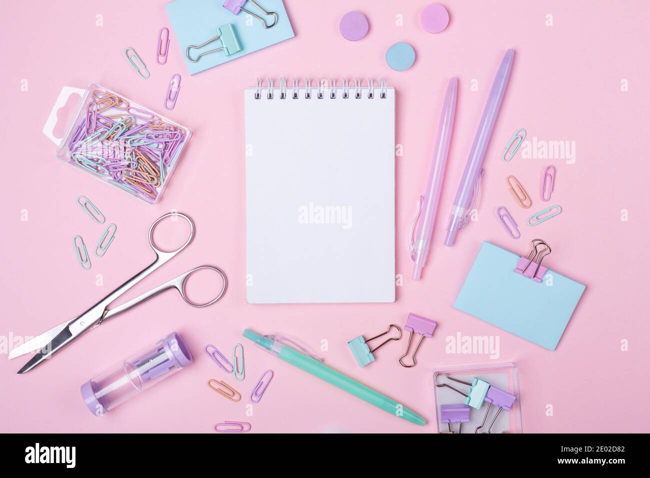 School background with notebooks and pastel colorful study accessories ...