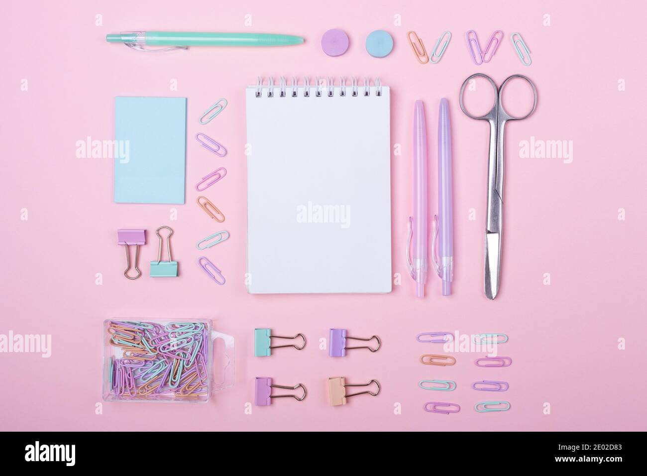 School background with notebooks and pastel colorful study accessories ...