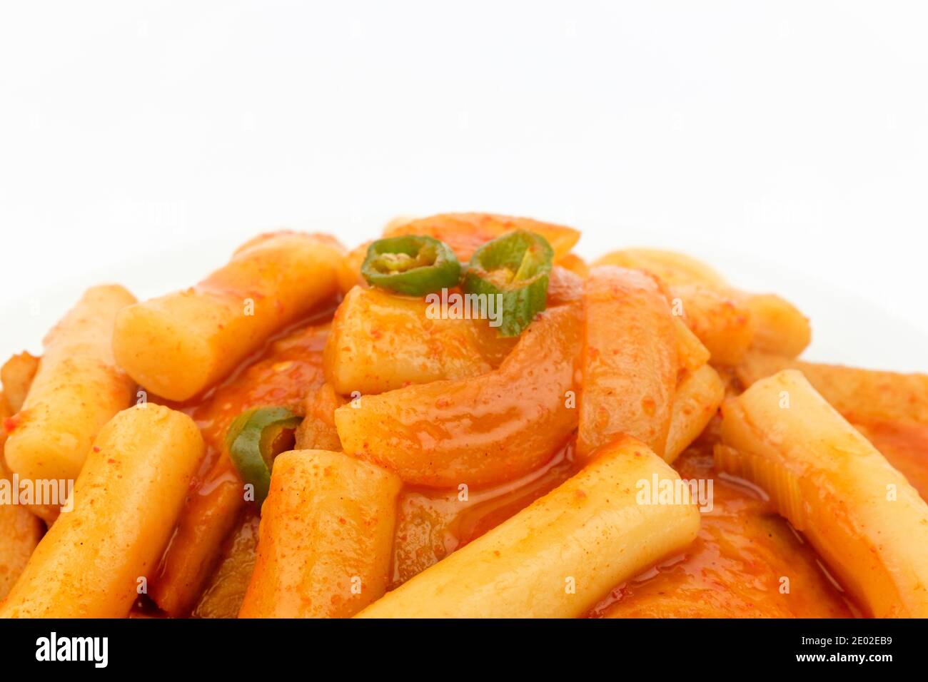 Red Tteokbokki on white background Stock Photo - Alamy