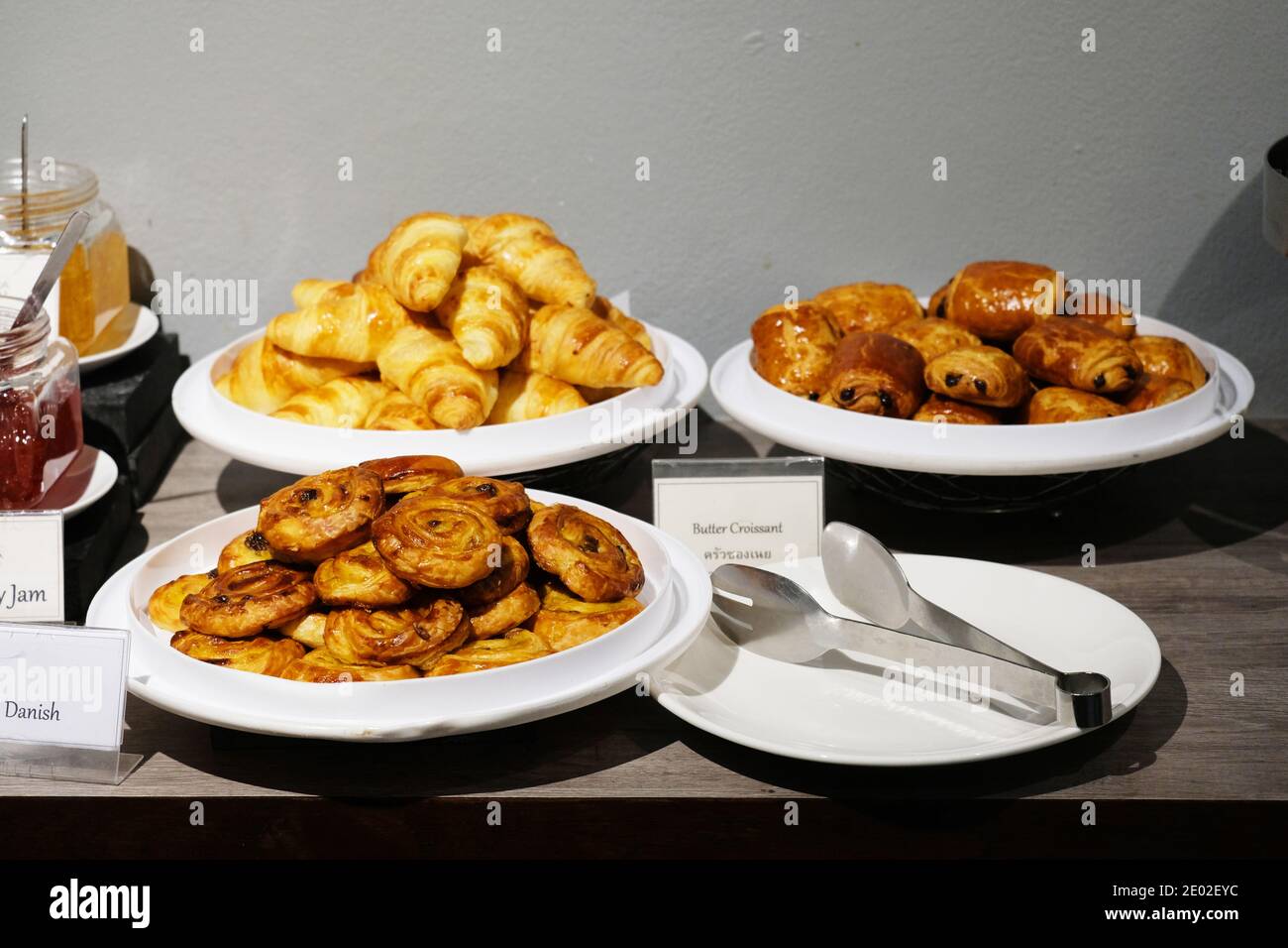 Three types of butter croissant on white plates Stock Photo - Alamy