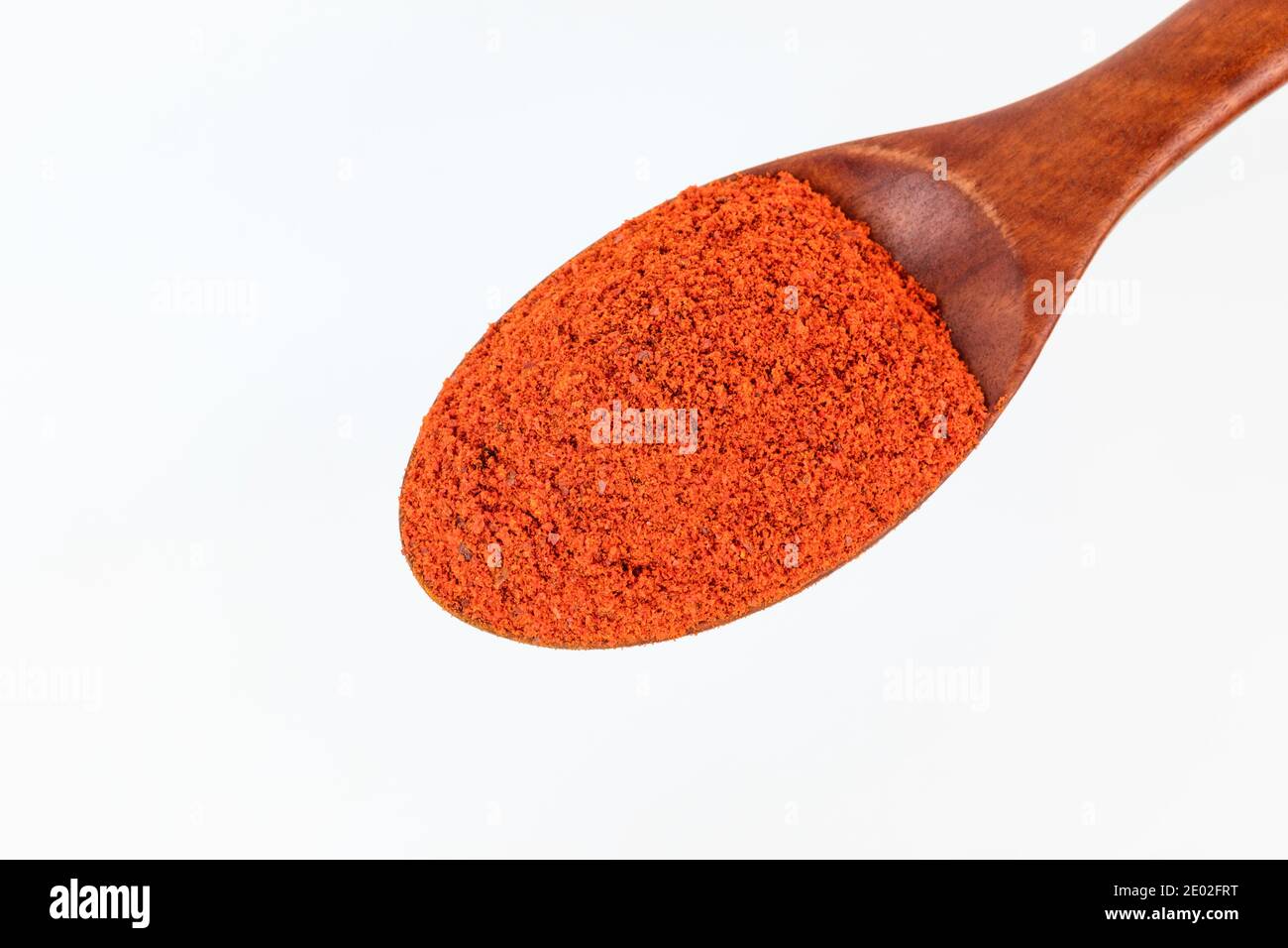Red pepper powder on white background Stock Photo - Alamy