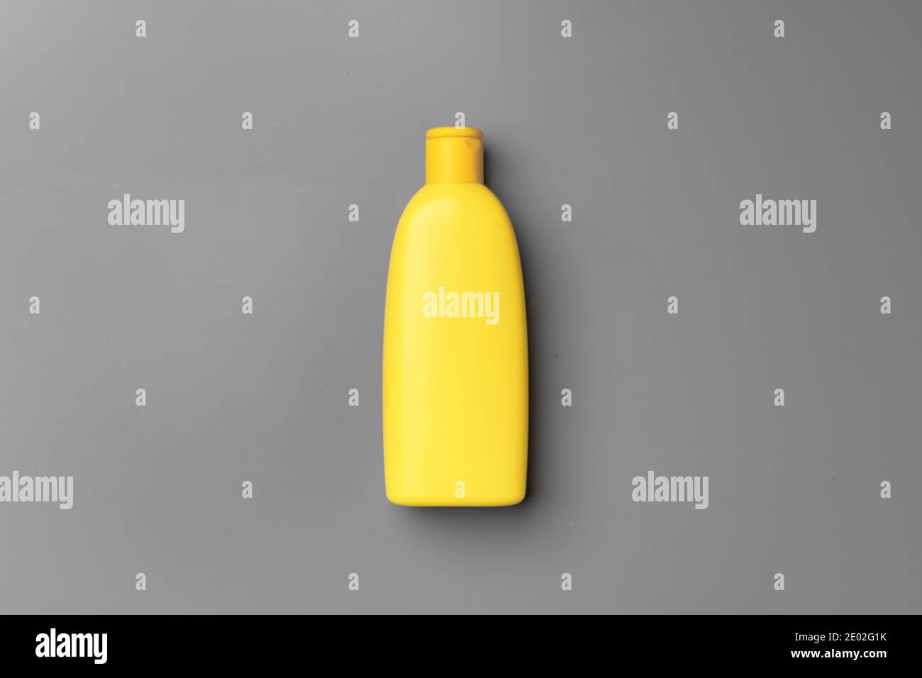 Yellow liquid detergents containers on gray background Stock Photo - Alamy