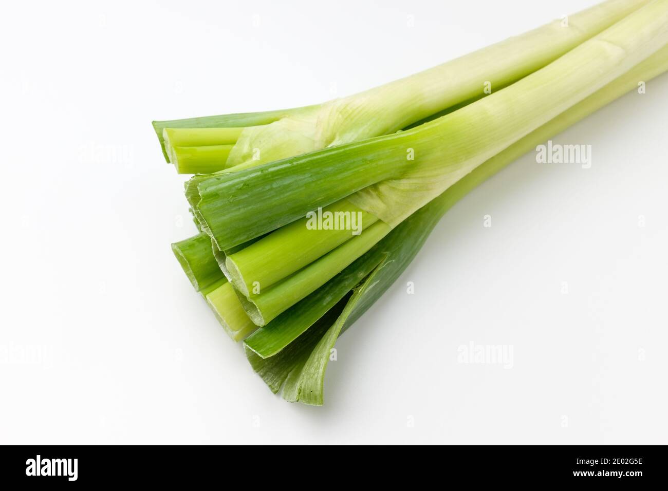 Fresh leeks on white background Stock Photo - Alamy