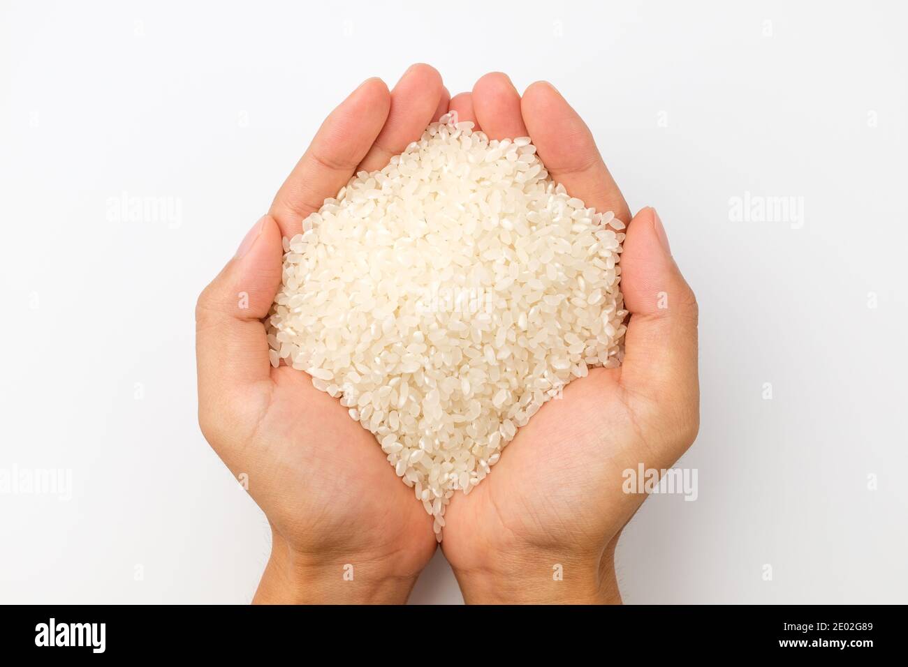 White rice on white background Stock Photo - Alamy