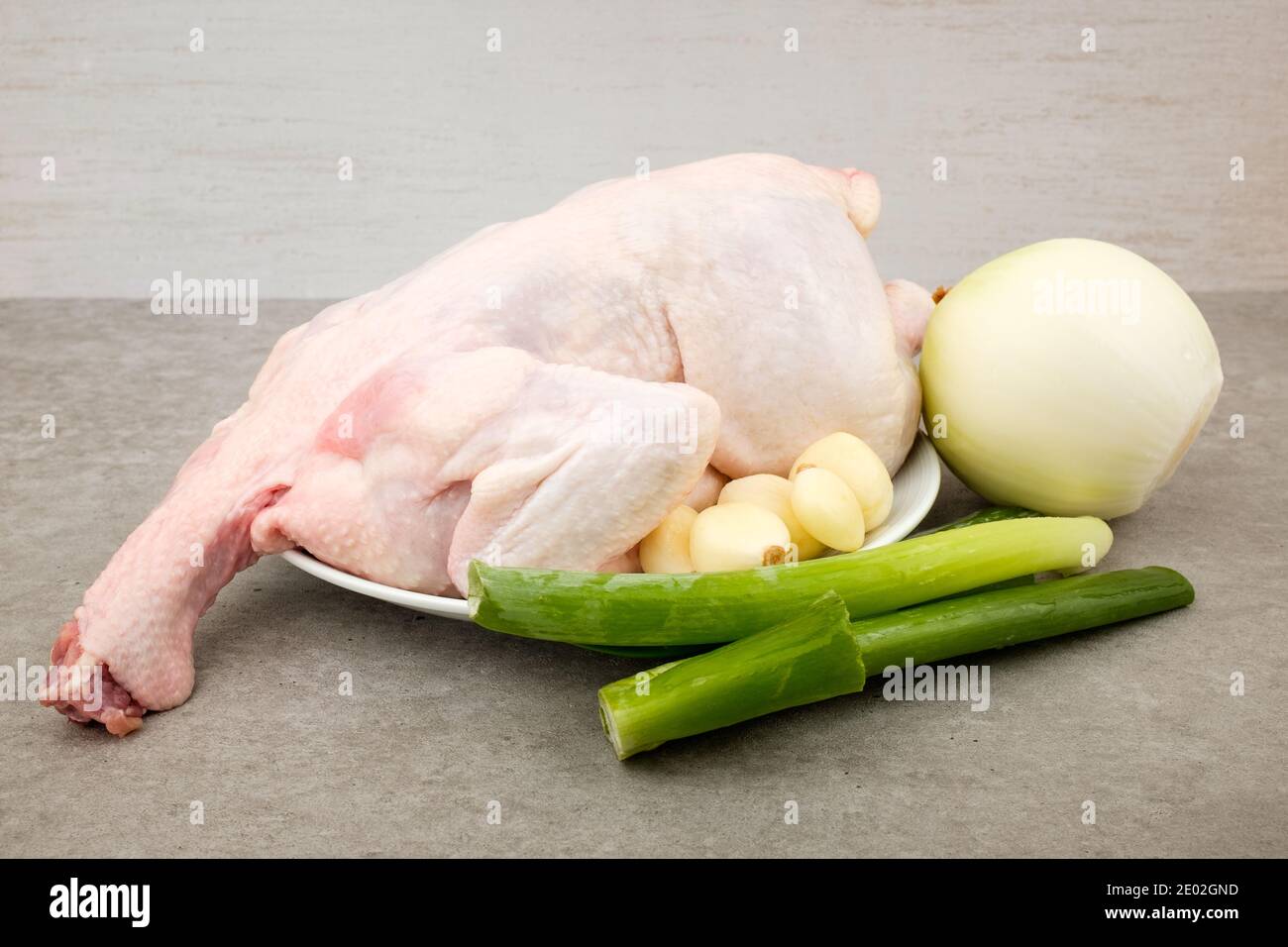 Raw chicken on rough background Stock Photo - Alamy