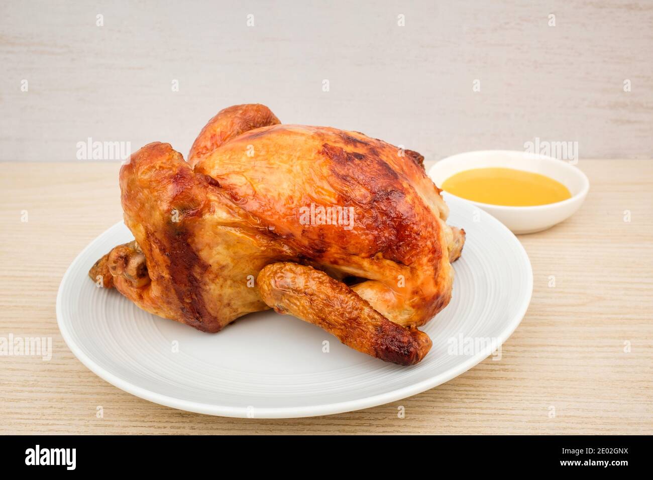 Roast chicken on white background Stock Photo - Alamy