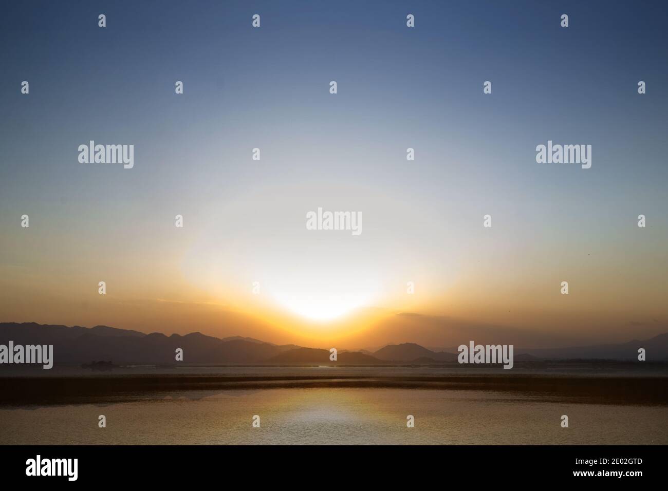 The landscape of a lake with a sunset sky background Stock Photo - Alamy