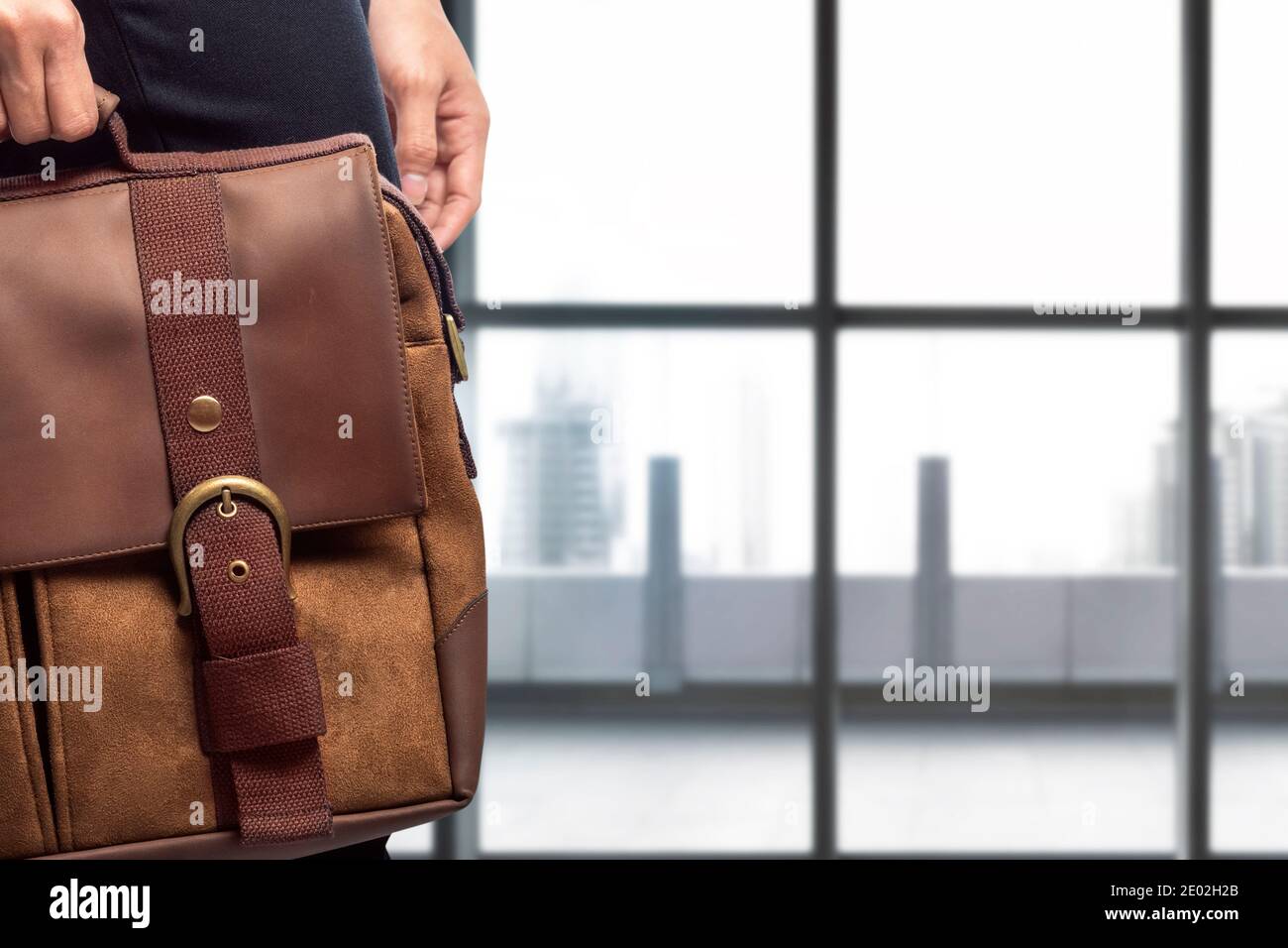 The business person carrying a briefcase to the office Stock Photo - Alamy