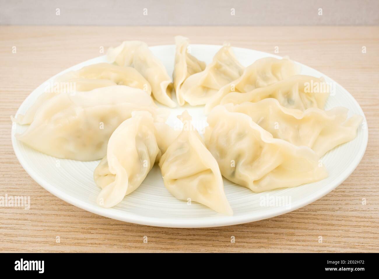 Small dumplings on white background Stock Photo - Alamy