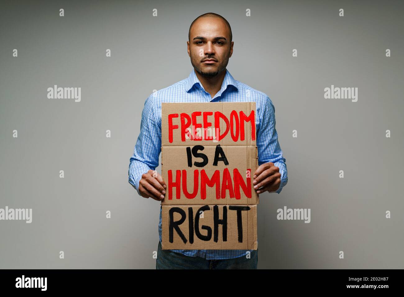 'Freedom is a human right' placard in hands of protester man Stock ...