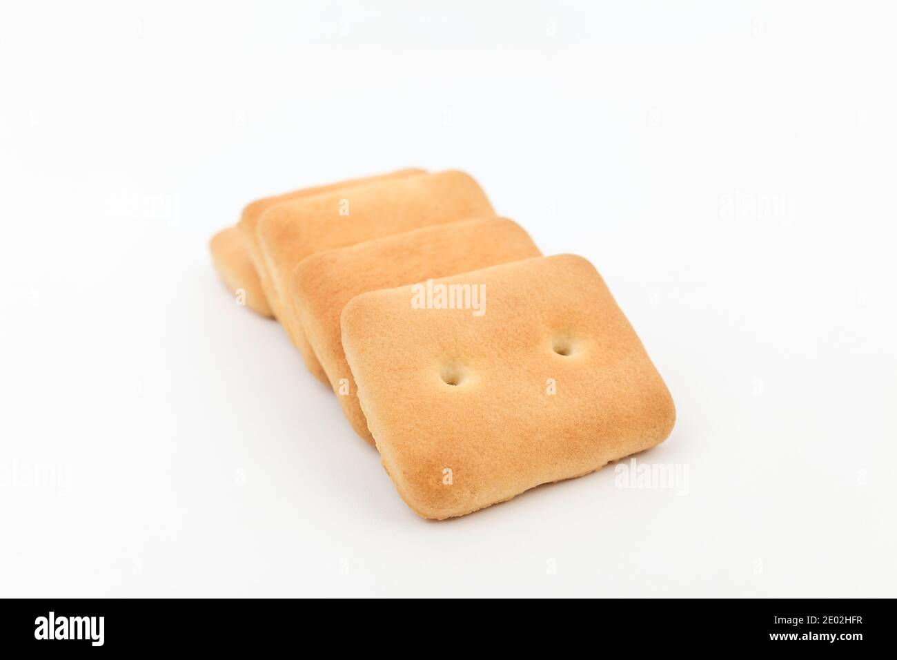 Small biscuit on white background Stock Photo - Alamy