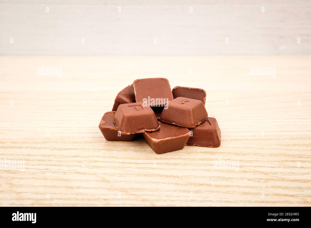 Small chocolate on white background Stock Photo - Alamy
