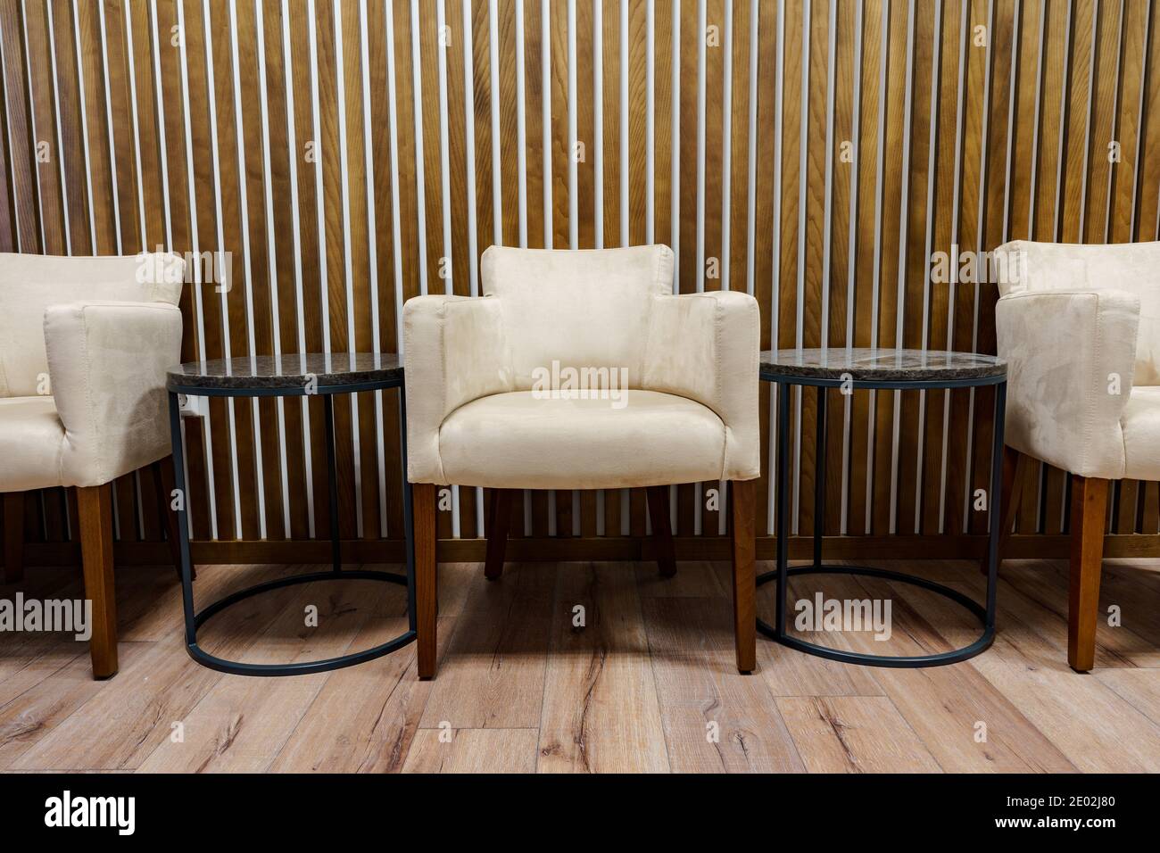Office waiting area with arm chairs and coffee table Stock Photo - Alamy