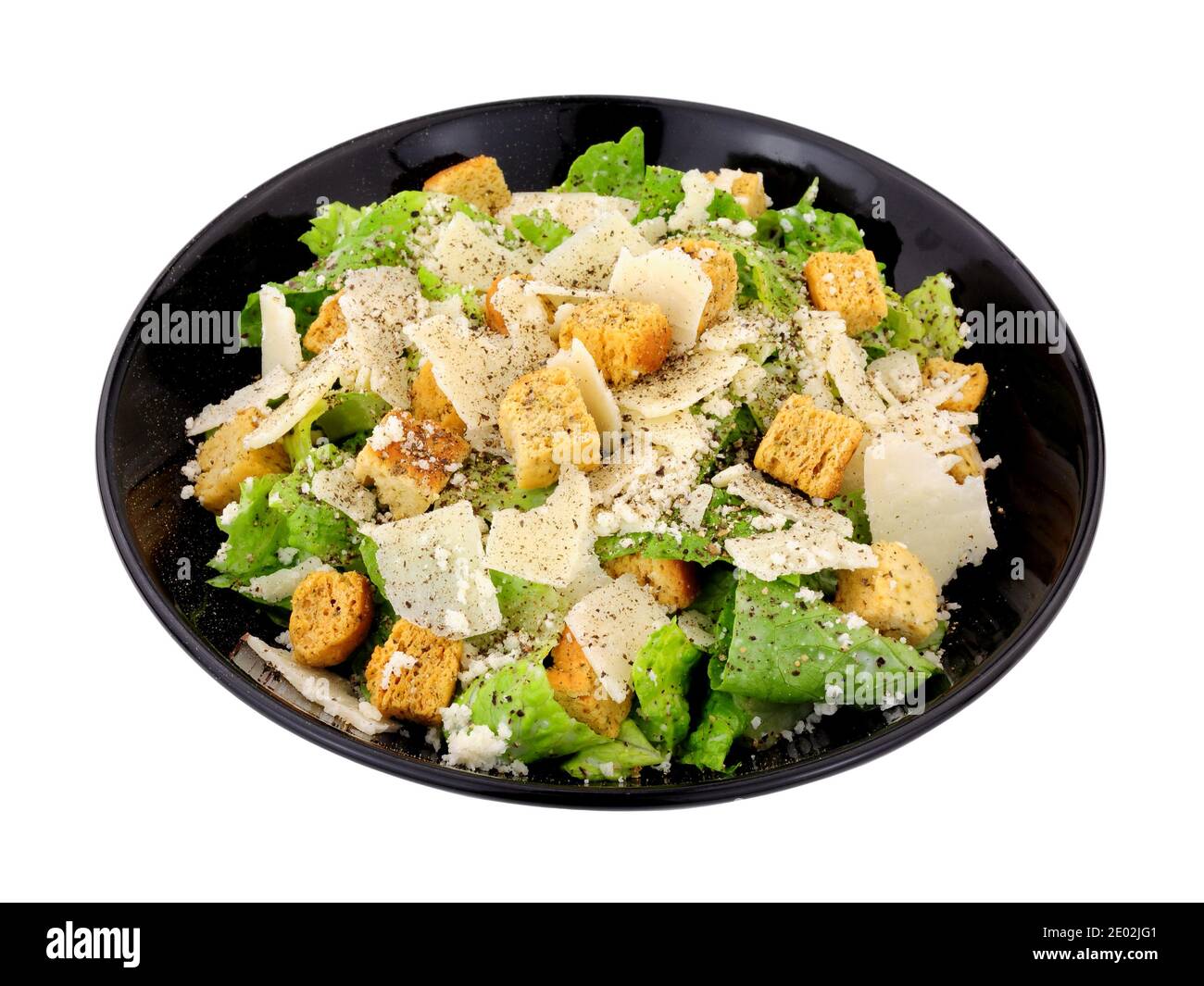 Classic Caesar salad with romaine lettuce and parmesen cheese shavings ...