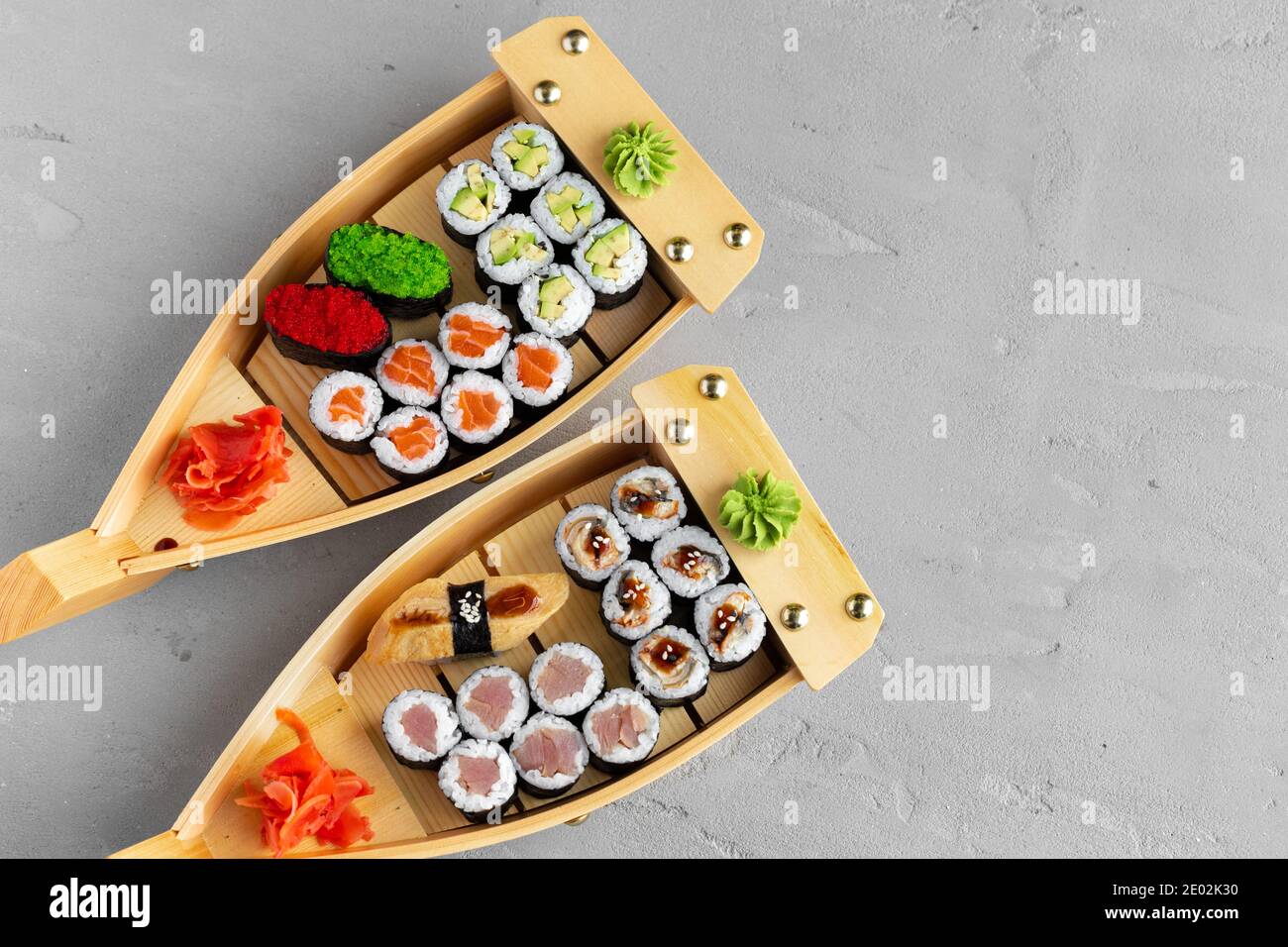 Set of maki sushi on wooden boat tray Stock Photo - Alamy