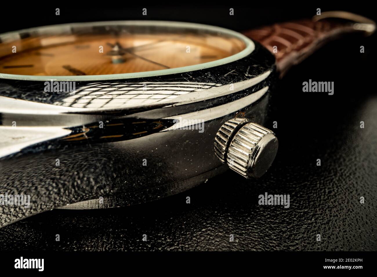 Old metal watch dial in dark macro photo Stock Photo - Alamy