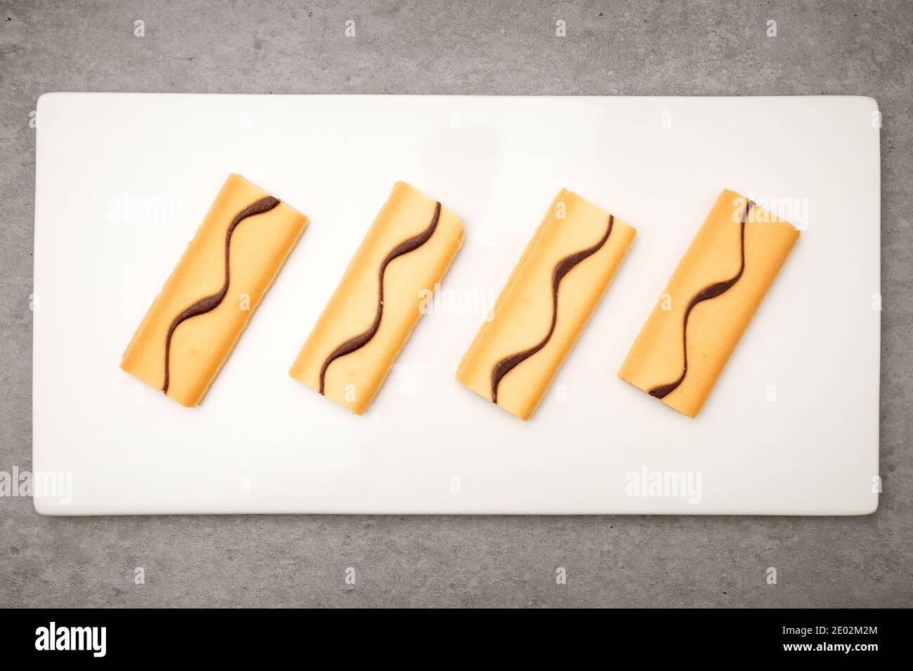 Thin biscuits on a white background Stock Photo - Alamy