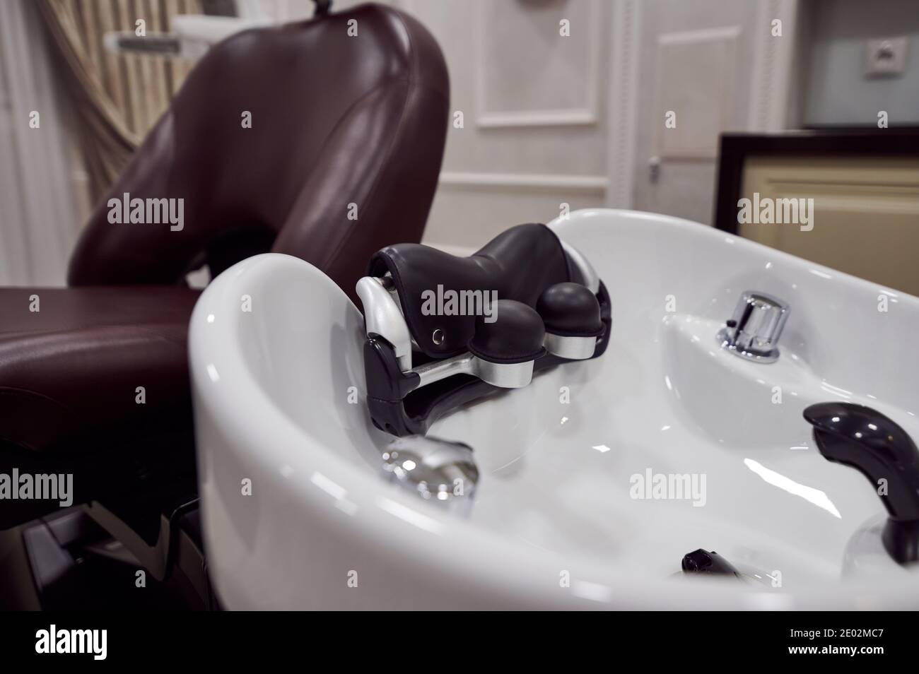 Focus on white clean shiny barber wash standing in beauty salon Stock ...