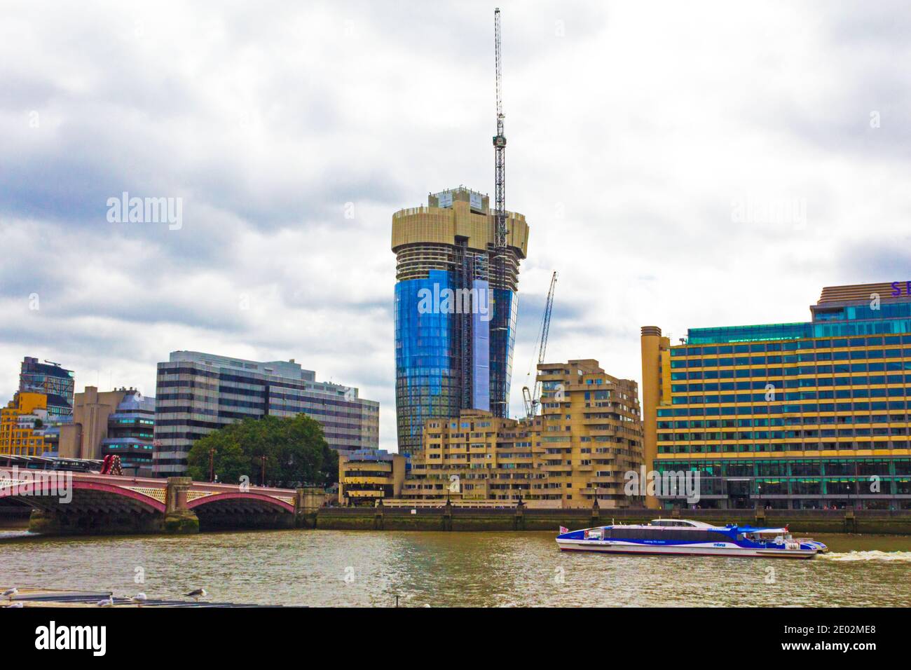 Modern buildings overlooking the River Thames on South bank and ...
