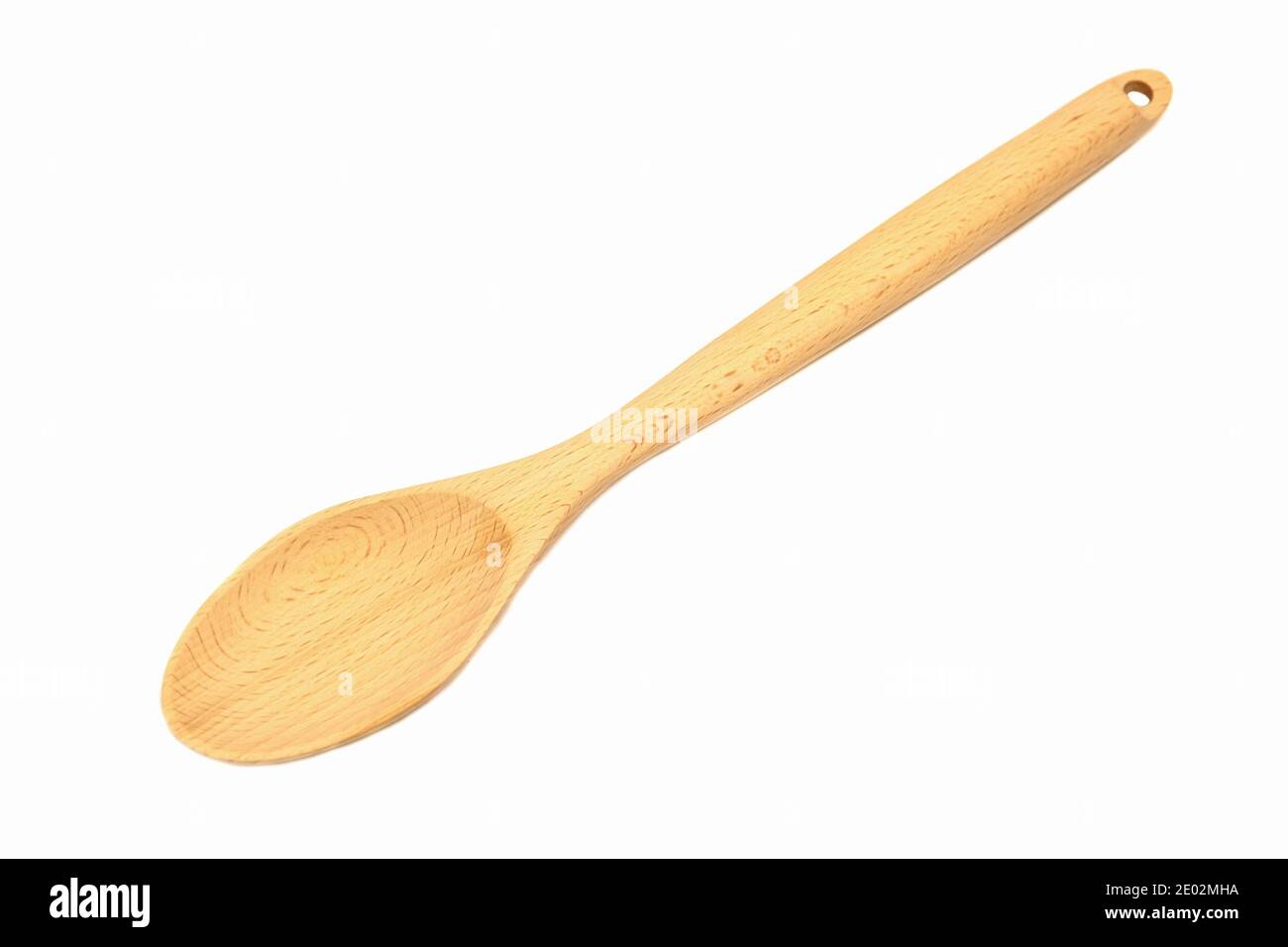 Light wooden spoon isolated on white background. Close-up Stock Photo ...